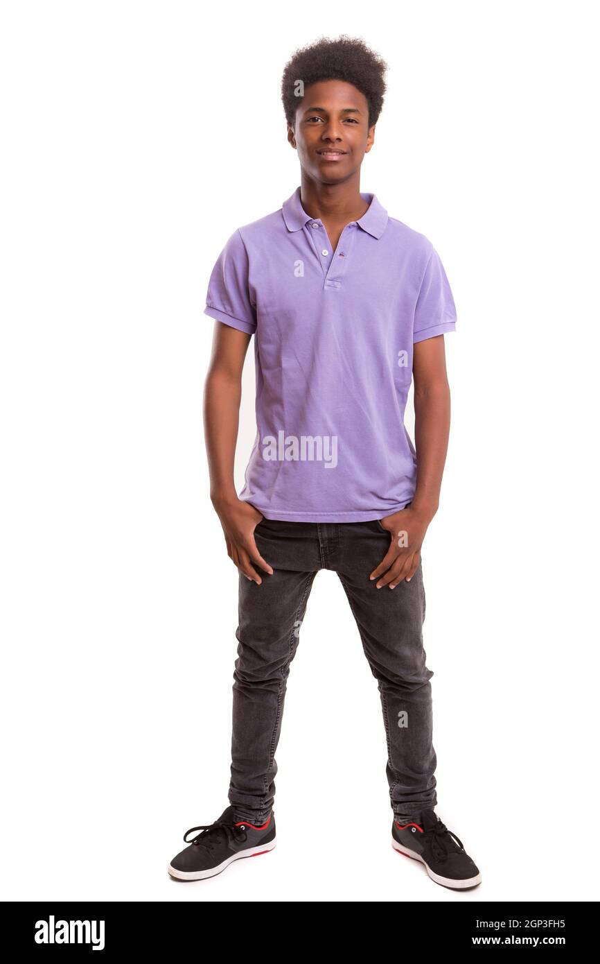 A casual young black boy posing isolated Stock Photo - Alamy