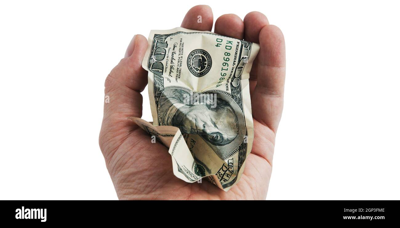 A crumpled hundred-dollar cash bill in his hand. Isolated on a white ...