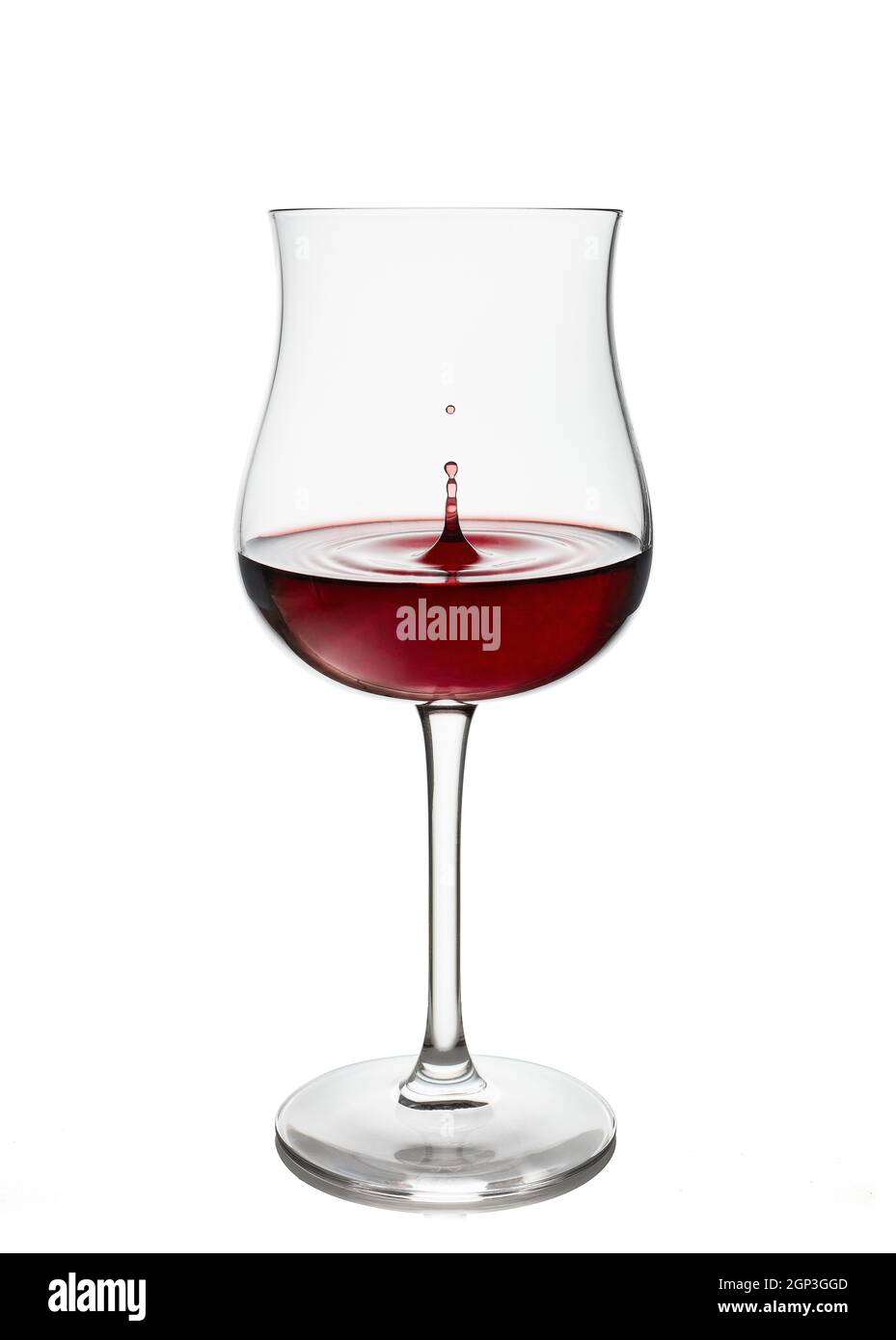 Splashing in glass. Red wine in wineglass isolated on white background ...