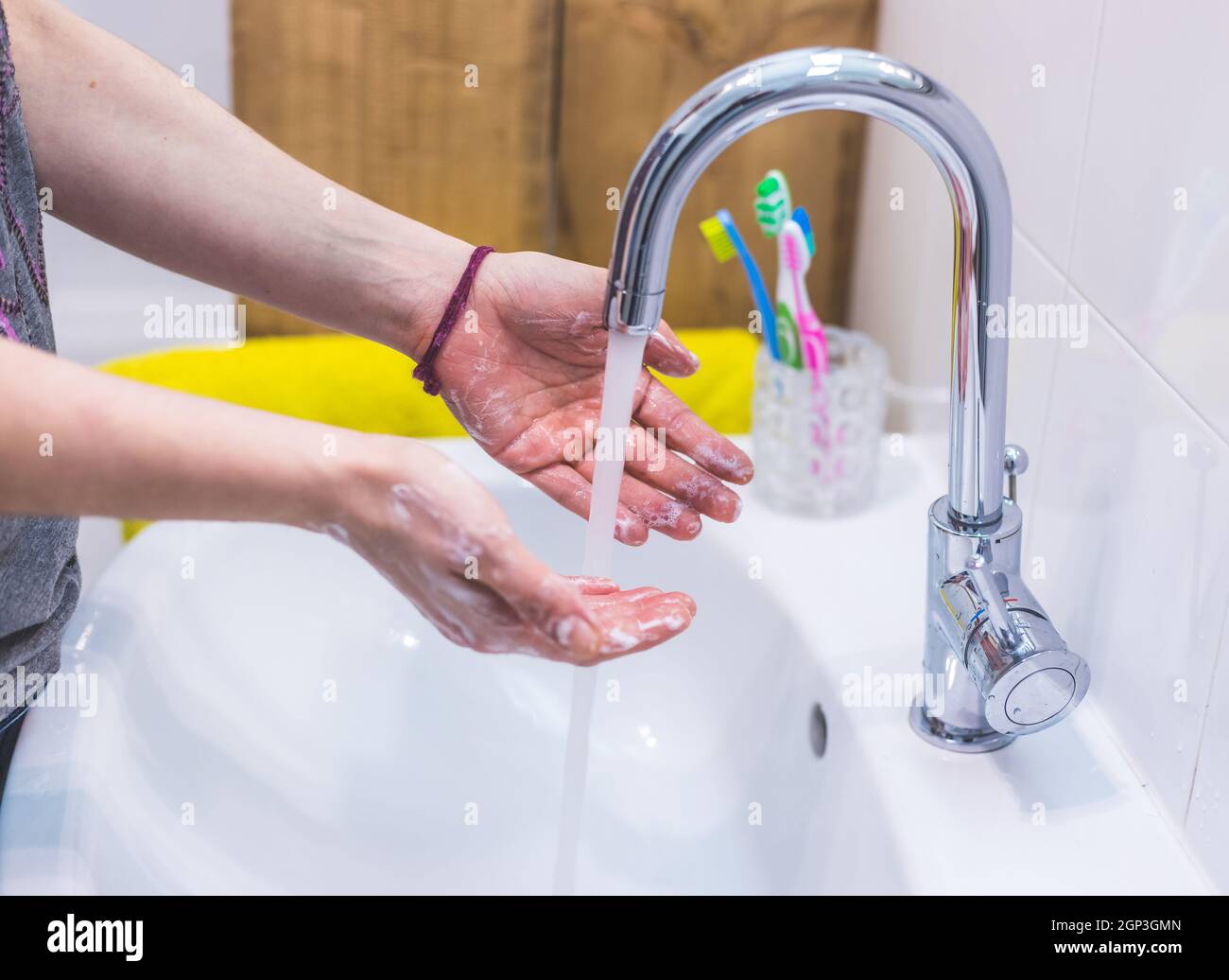 Close up washing hands in the bathroom. Prevention against flu or ...
