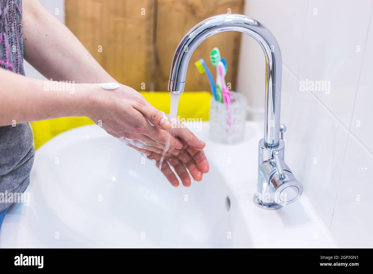 Close up washing hands in the bathroom. Prevention against flu or ...