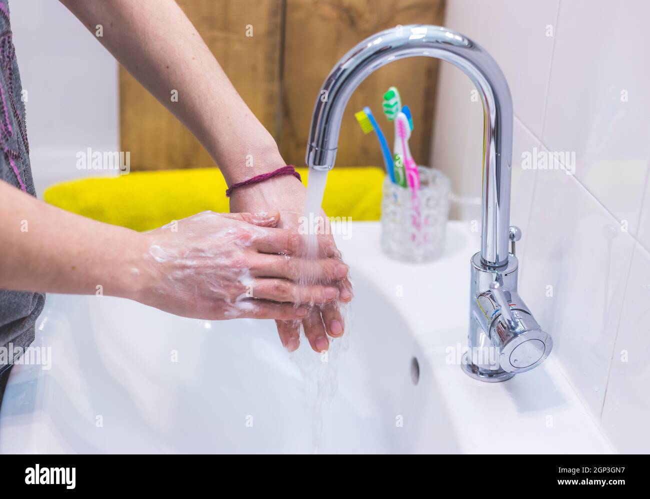 Close up washing hands in the bathroom. Prevention against flu or ...
