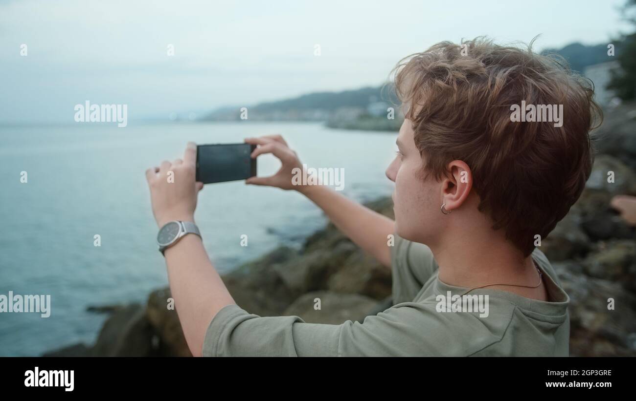 Boy watching sunset hi-res stock photography and images - Alamy