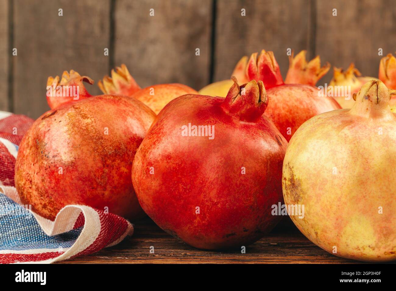 Group of pomegranate fruits close up background Stock Photo - Alamy