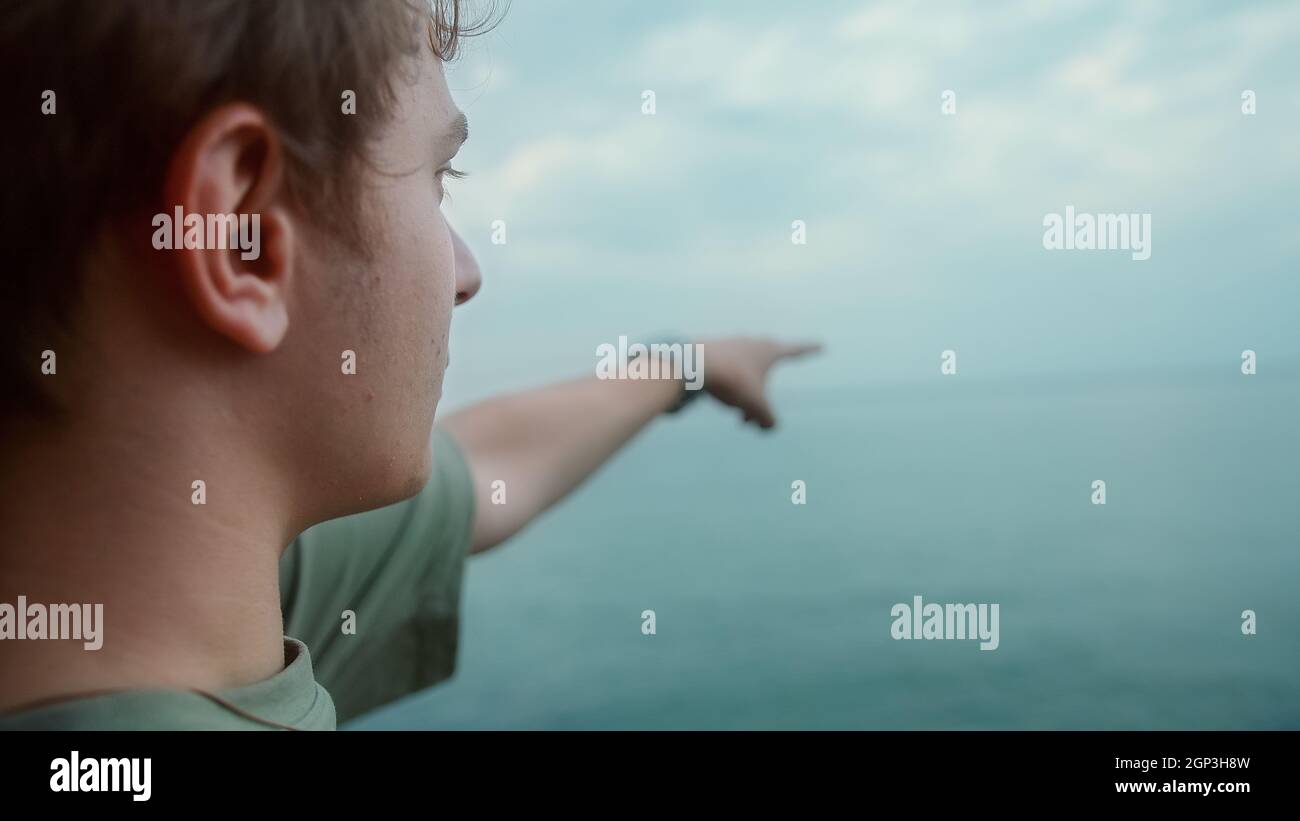 Man pointing out out sea hi-res stock photography and images - Alamy