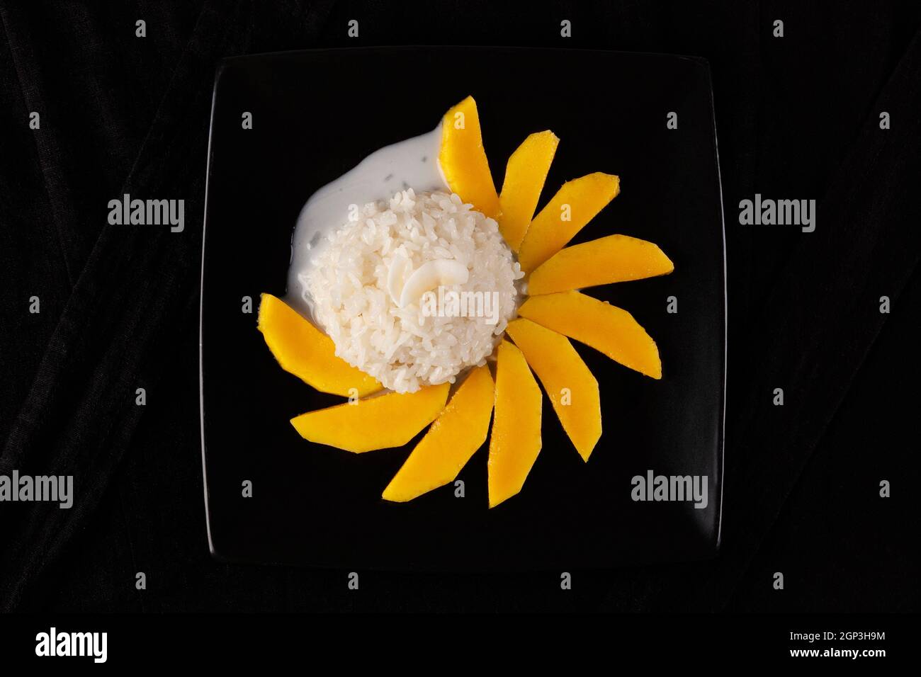 Khao niew mamuang, Mango sticky rice, delicious Thai dessert on black ...