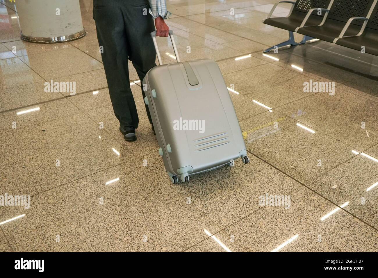 Man pulling trolley hi-res stock photography and images - Alamy