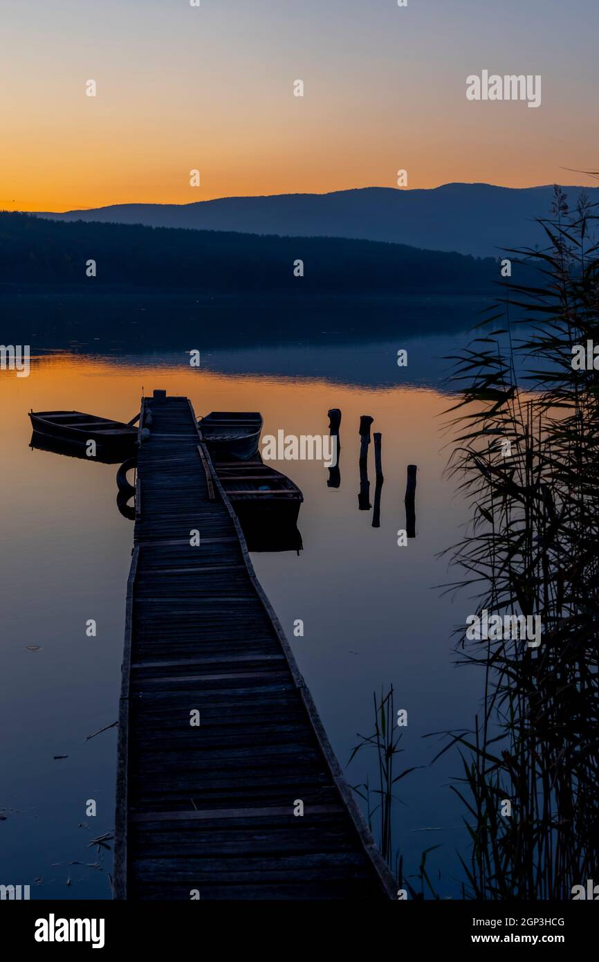 fishing boat at pier on Jenoi pond near Diosjeno, Northern Hungary ...