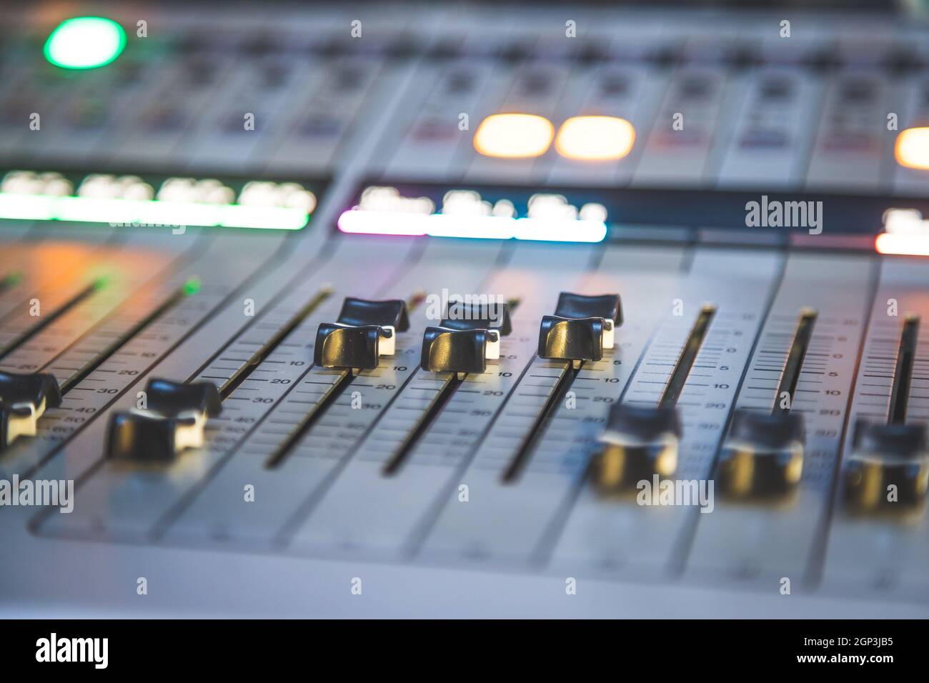 Professional music production in a sound recording studio, mixer desk ...