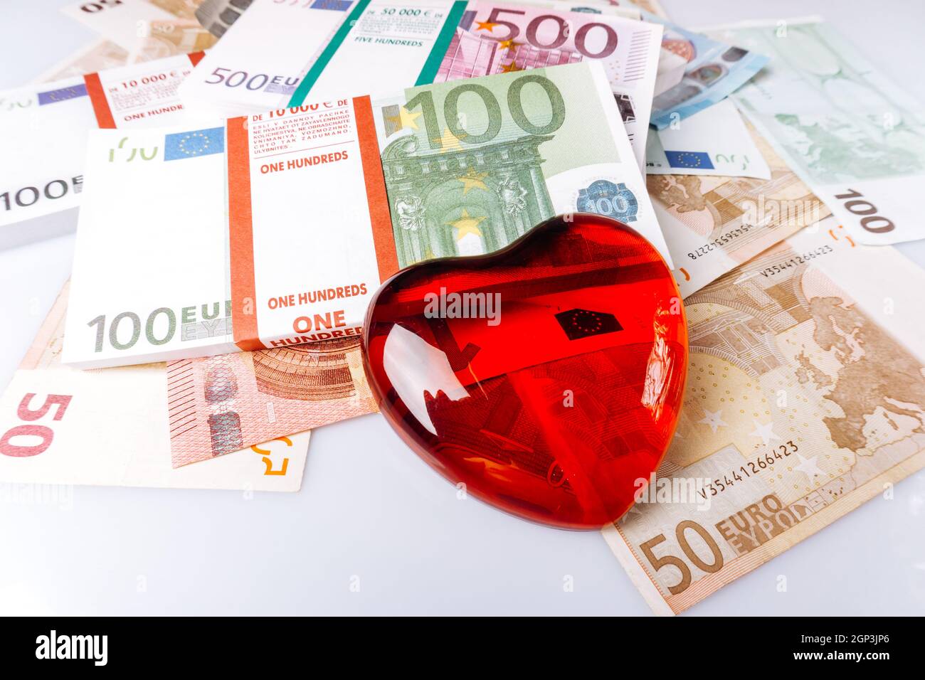 Heart shape on Euro banknotes. The heart lies on the Euro banknotes ...