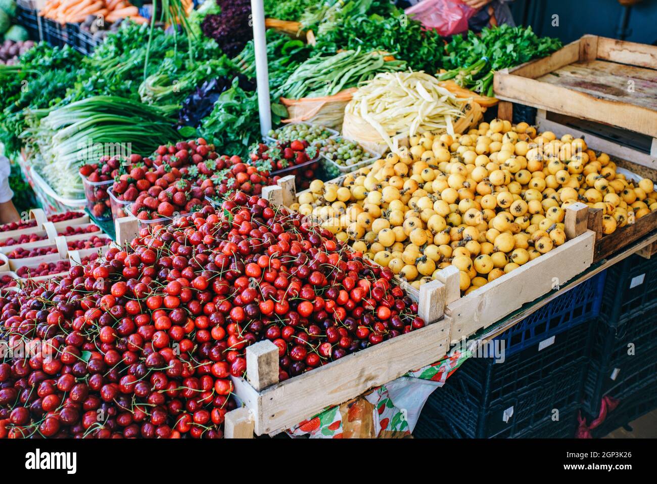 Fresh fruit in the market. Apricots, peaches, cherries, apples Stock ...