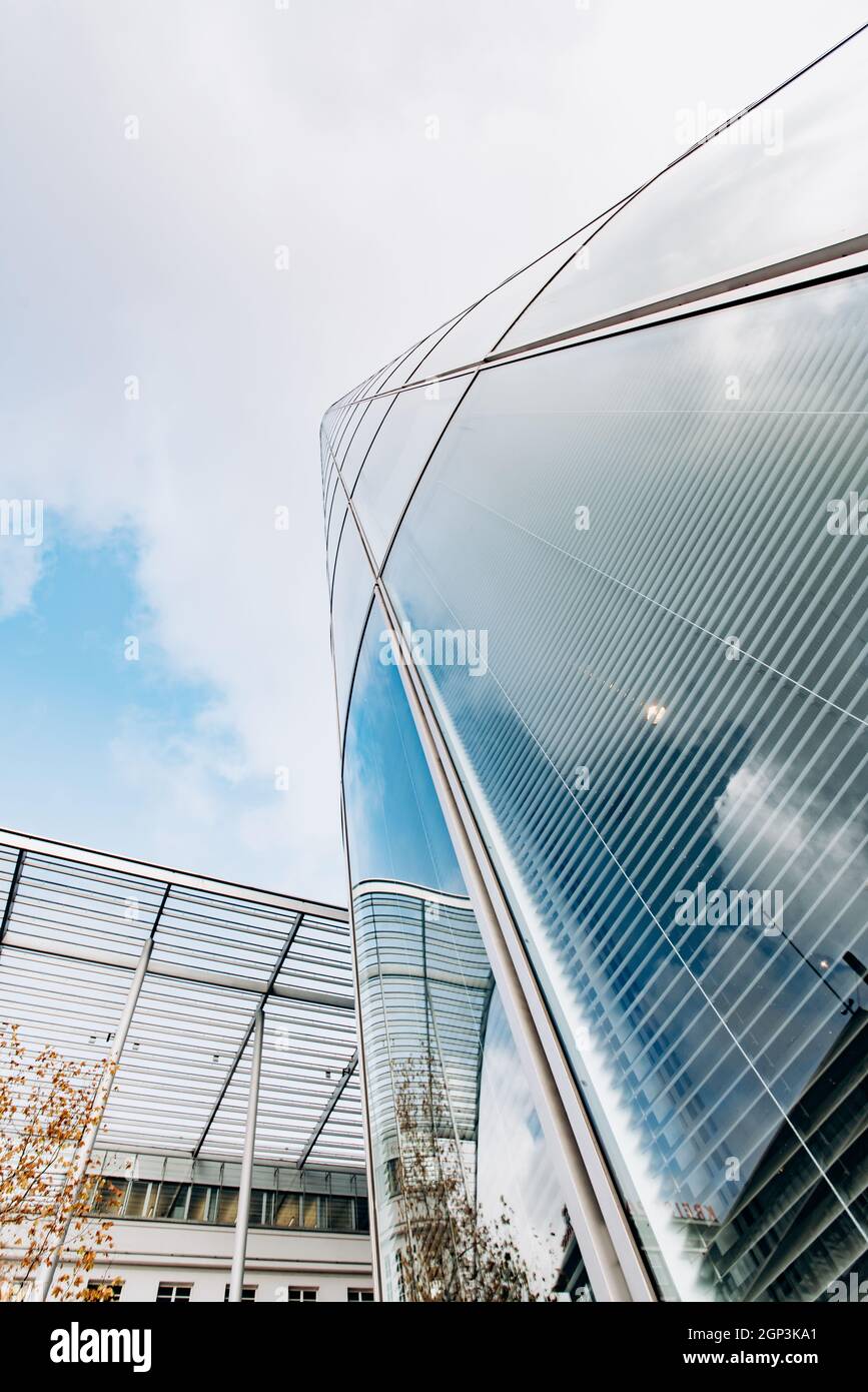 Reflection of the sky on a skyscraper. View of skyscrapers from below ...
