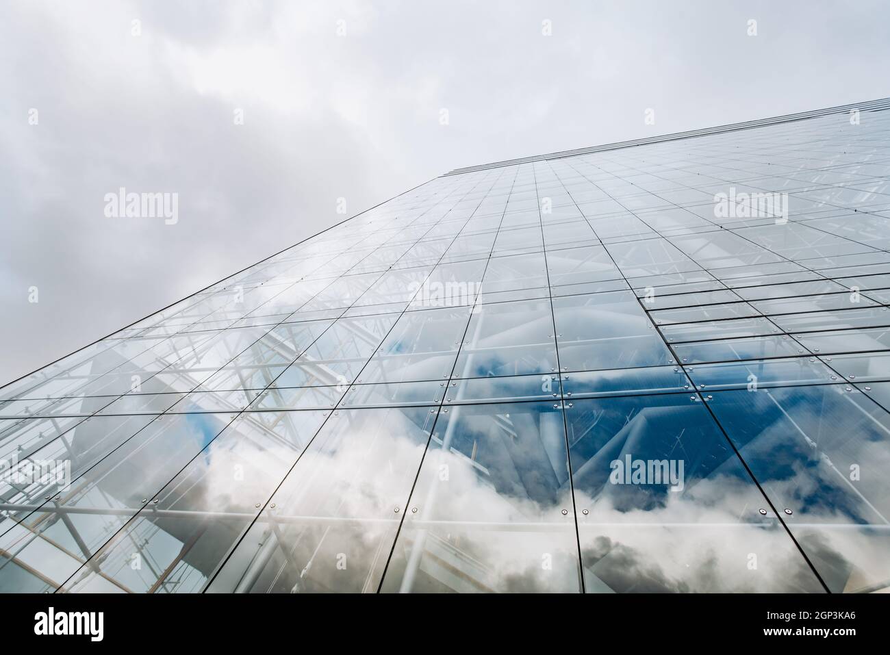 Reflection of the sky on a skyscraper. View of skyscrapers from below ...