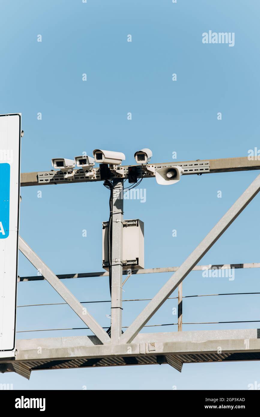 Security cameras on a pole near the road. CCTV camera Stock Photo - Alamy