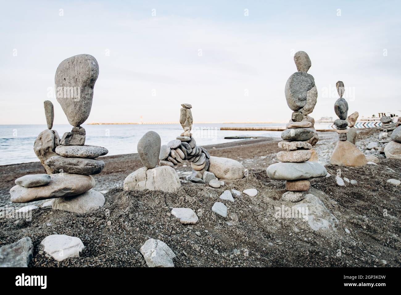 Figures of stones on the beach near the sea. Sea background and stone ...