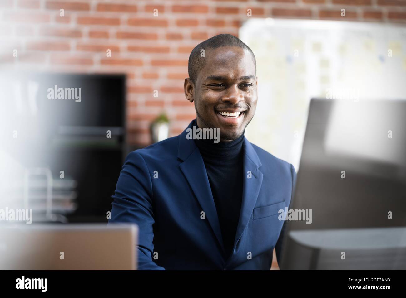 Happy Professional African Employee In Office Typing Stock Photo - Alamy