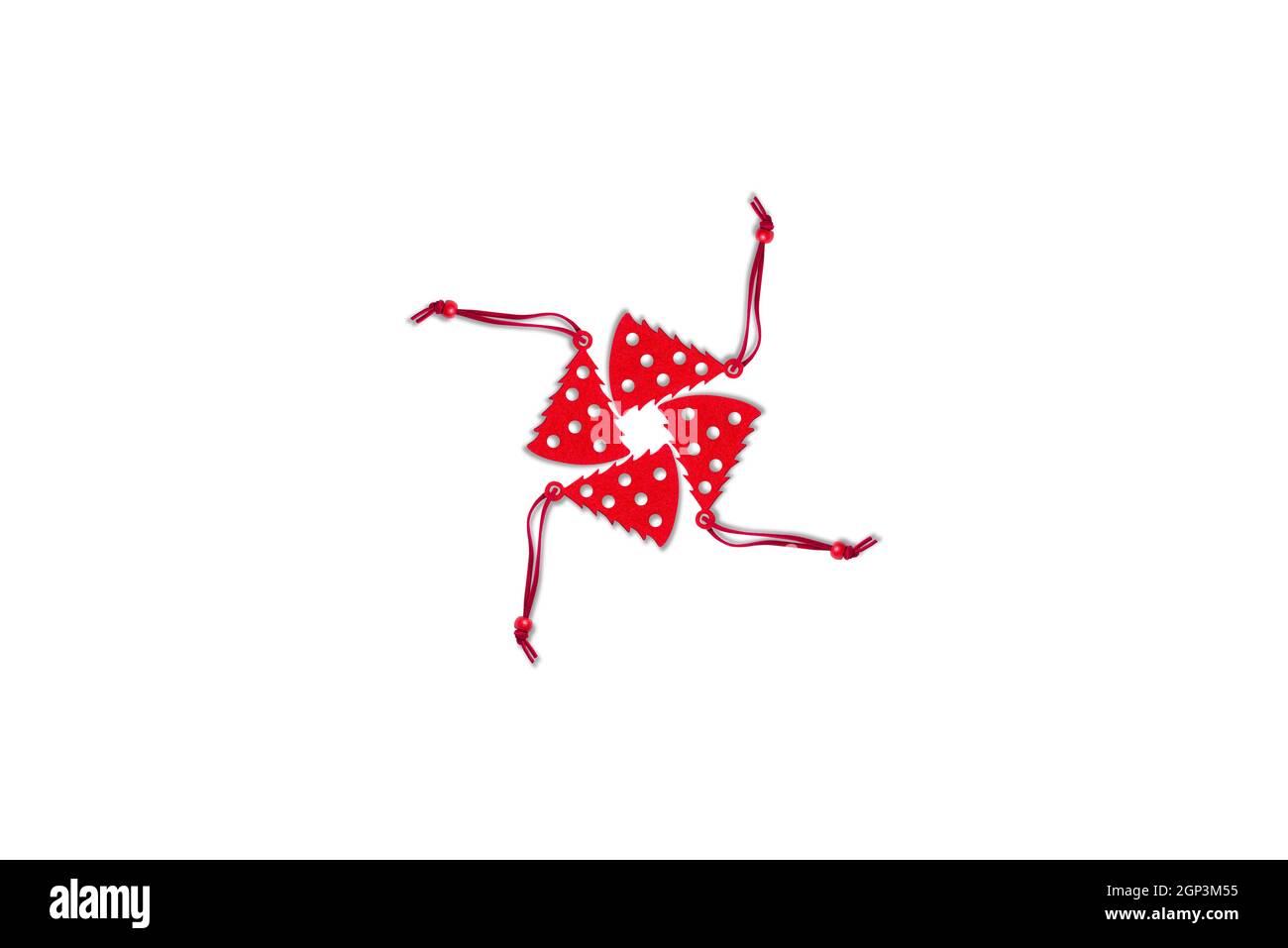 Small red Christmas trees on a white background Stock Photo - Alamy