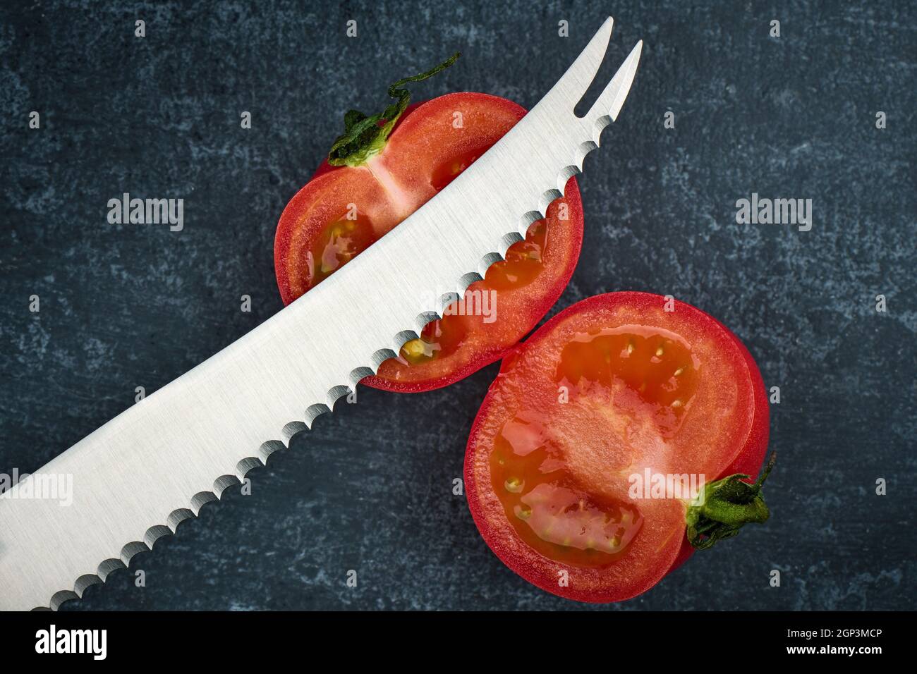 Tomato cut with a special tomato knife, top view, close up Stock Photo ...