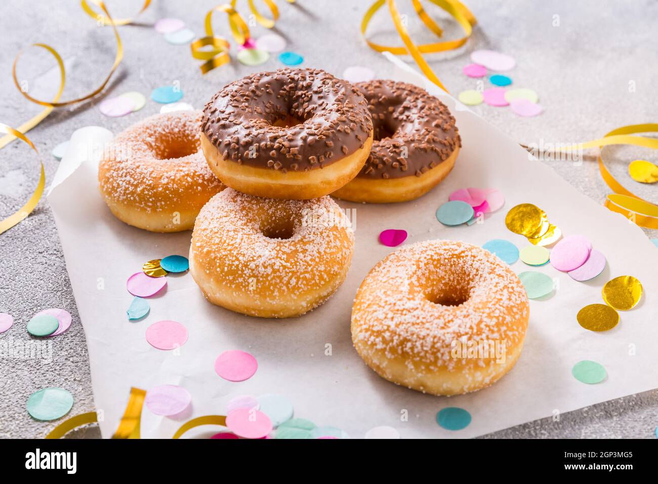 Donuts for carnival and party. Donuts with streamers and confetti ...