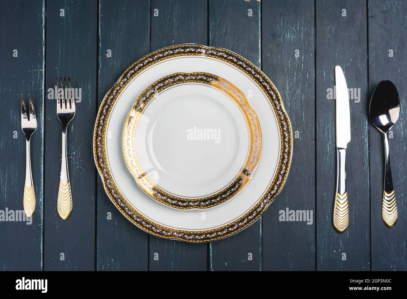 Top view of table setup on dark wooden background Stock Photo - Alamy