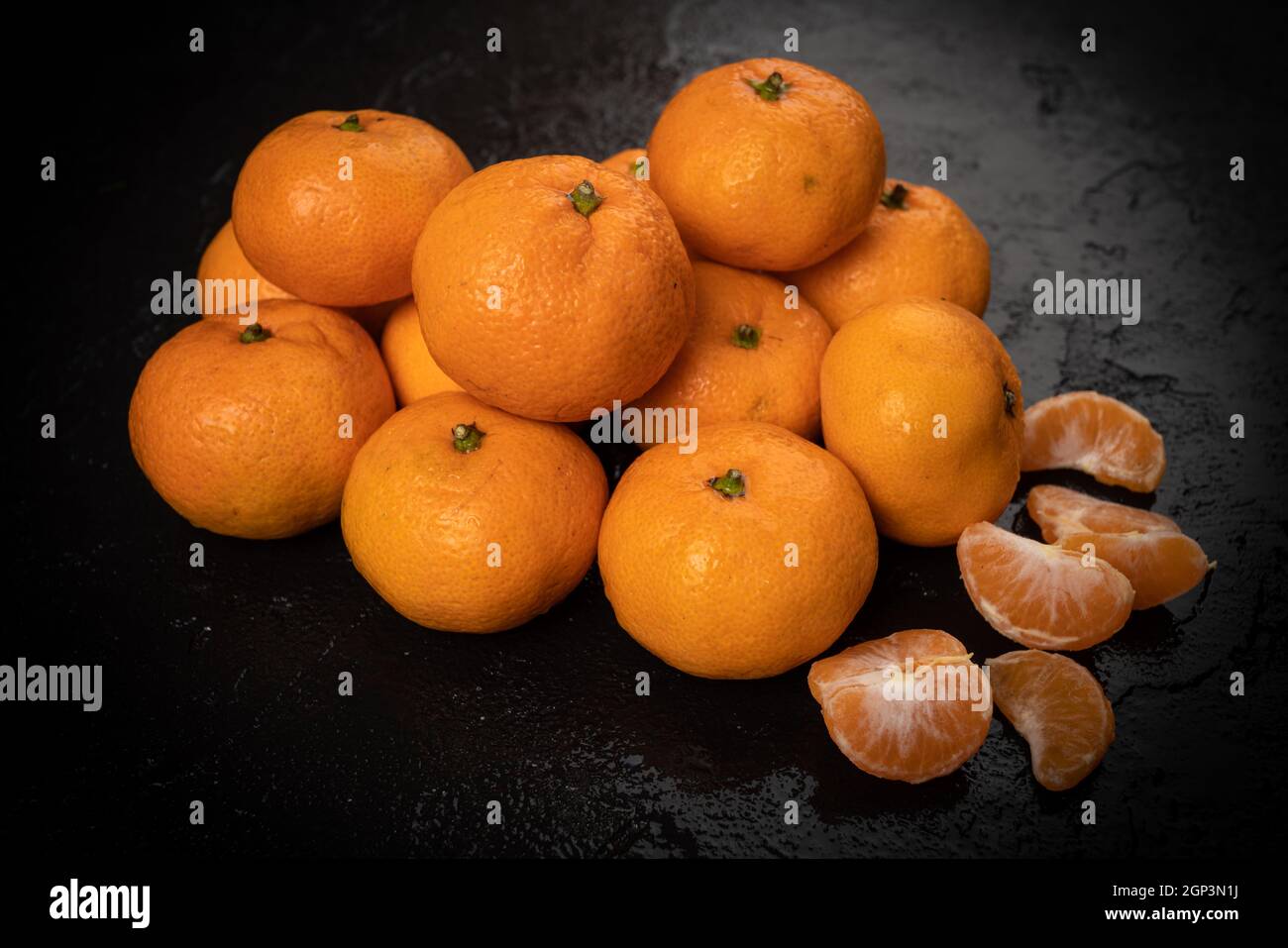 Juicy mandarin on black background. Mandarin Fruit Stock Photo - Alamy