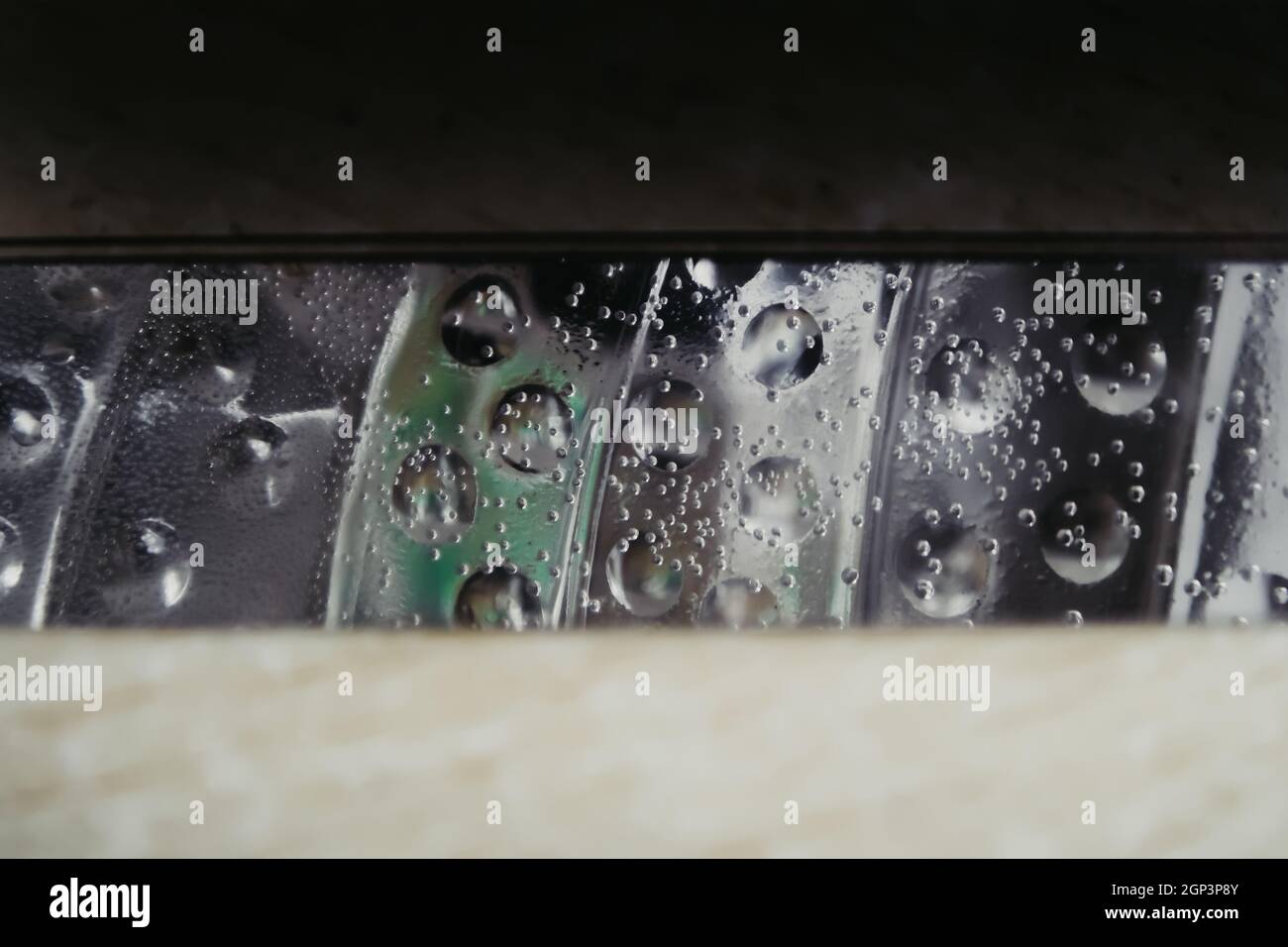 Close up of reflection of sparkling water on glass Stock Photo - Alamy