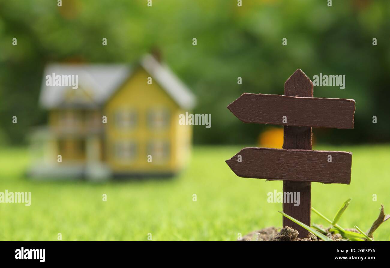 Rustic Signboard in Rural Outdoor Area, Blurred Farmhouse in background ...