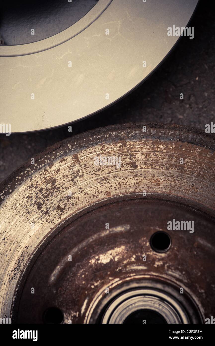Close up shot of a car worn and rusty brake disk and a new one Stock ...