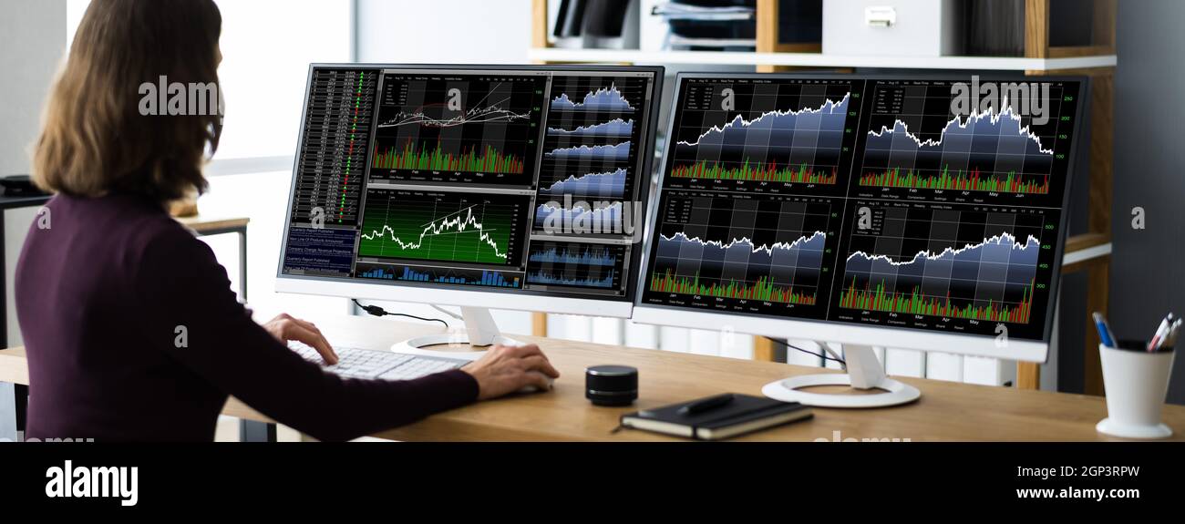 Financial Broker Or Trader Woman At Office Desk Stock Photo - Alamy