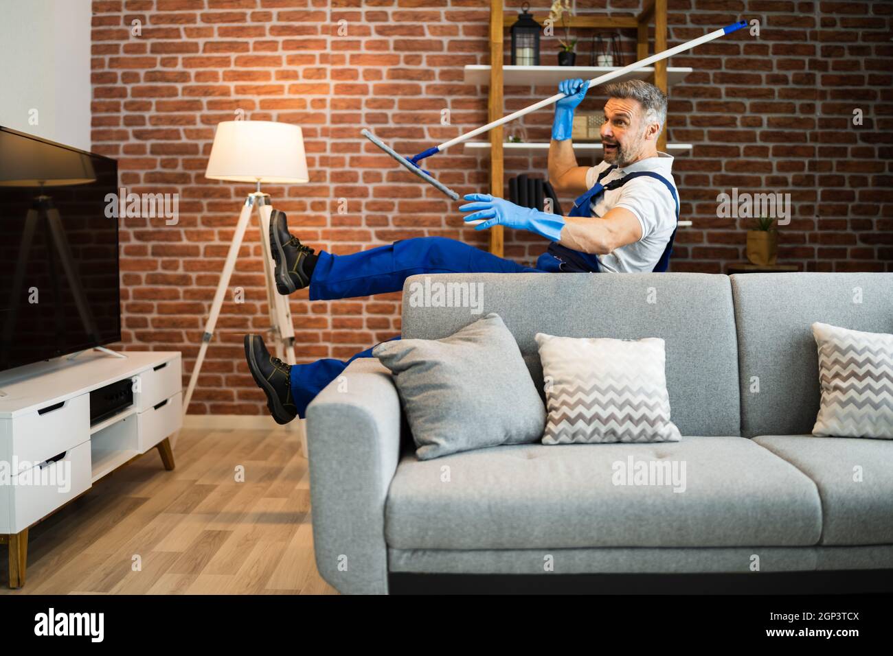 Domestic Slip And Fall Accident At Home. Falling Janitor Stock Photo ...