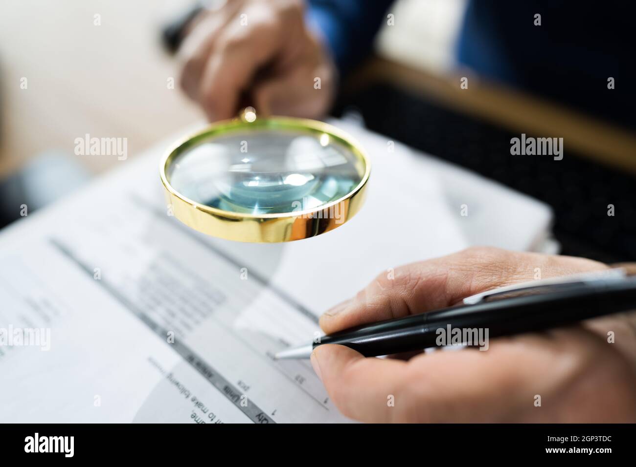 Fraud Detective Using Magnifying Glass Or Loupe Stock Photo - Alamy