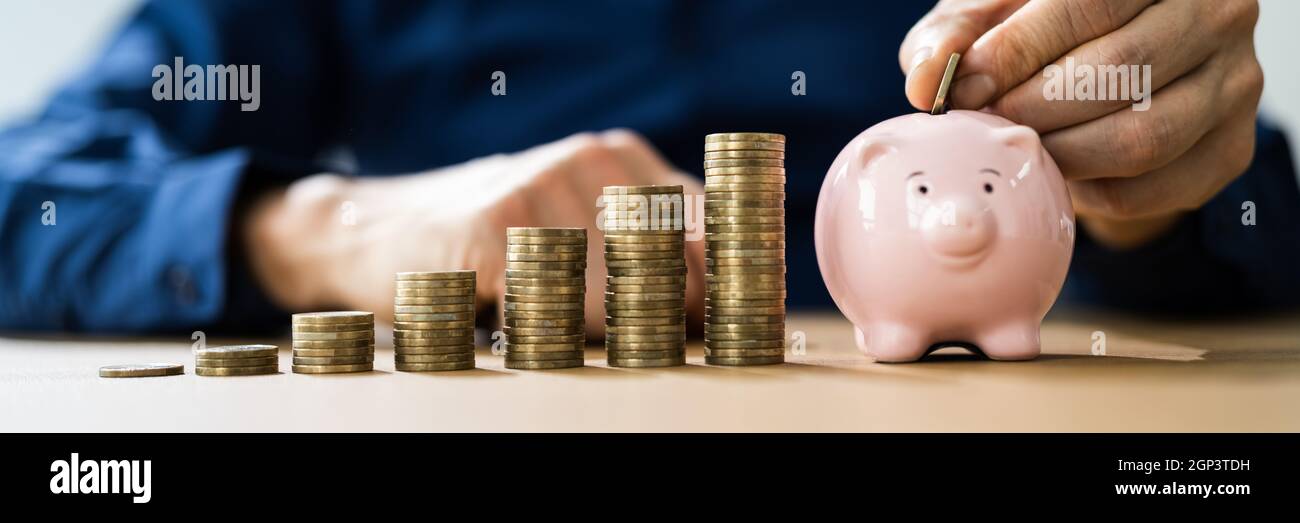 Saving Money And Budgeting Using Piggybank Concept Stock Photo - Alamy