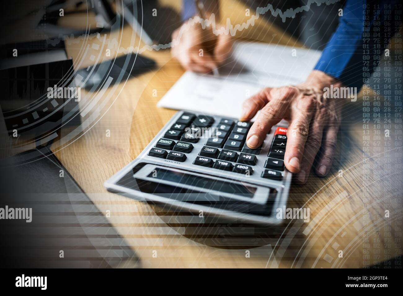Caucasian worker using calculator hi-res stock photography and images ...