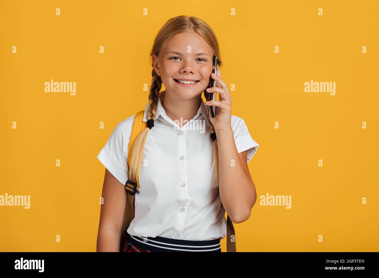 Cheerful smart european young girl student with pigtails and backpack ...