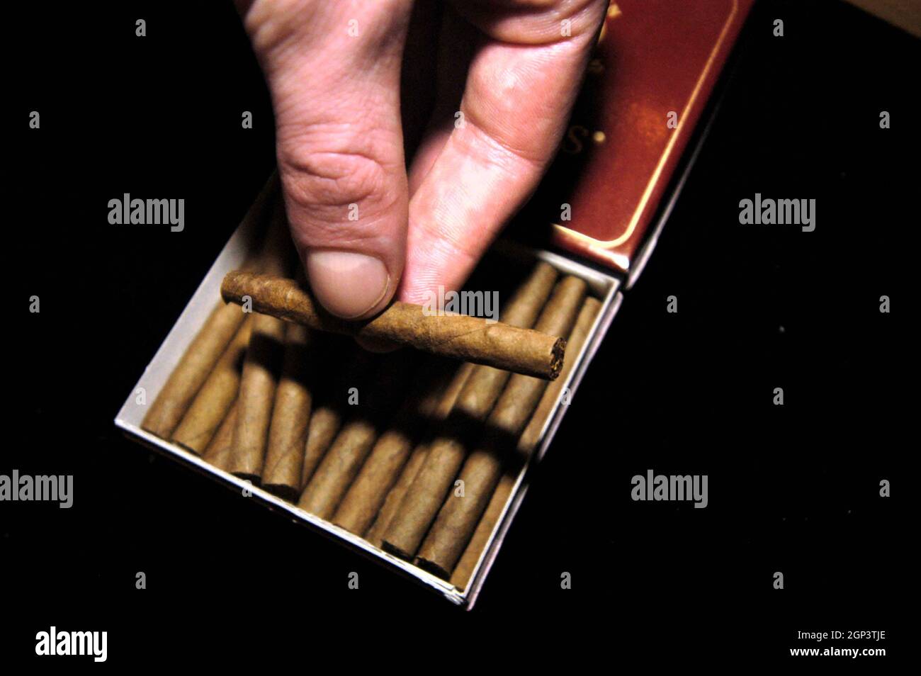 Smoking a cigarillo hi-res stock photography and images - Alamy