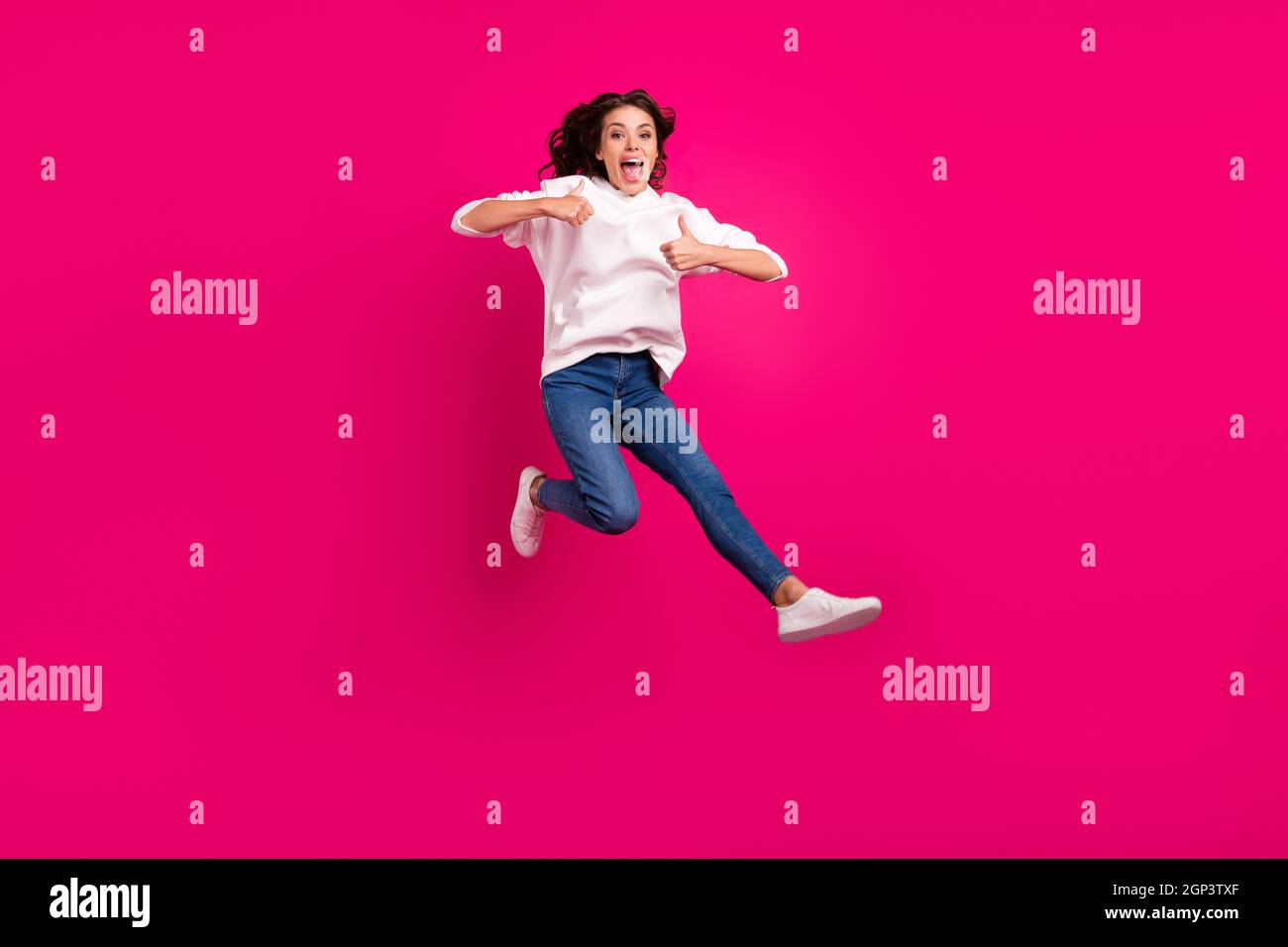 Full length photo of young girl happy positive smile jump up show ...
