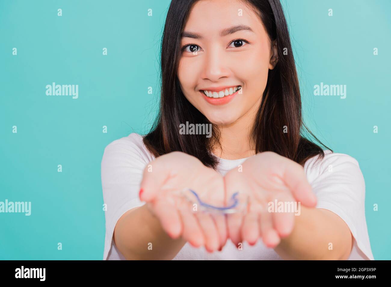 Portrait young Asian beautiful woman smiling holding silicone ...