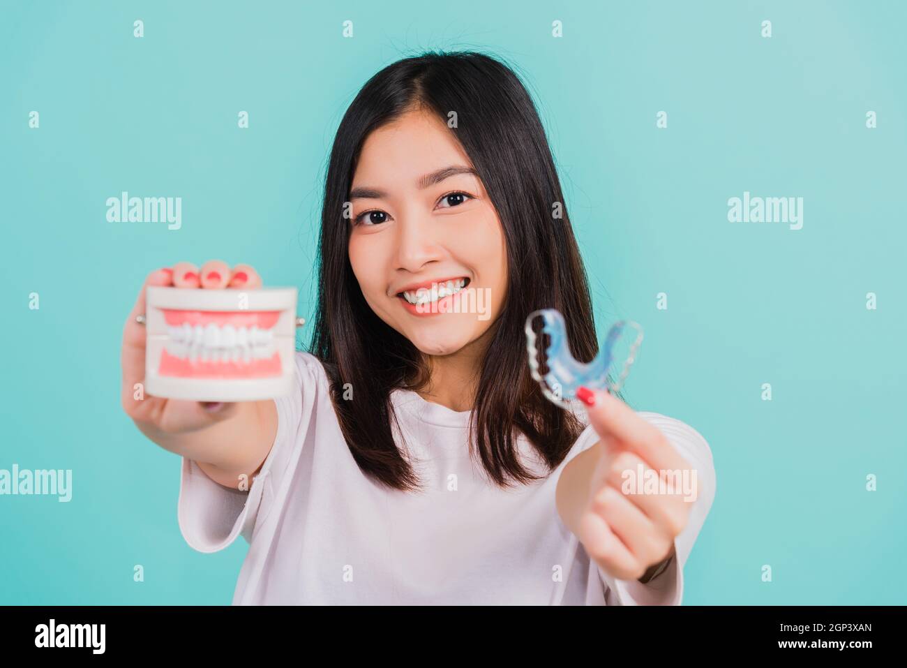 Portrait young Asian beautiful woman smiling holding silicone ...