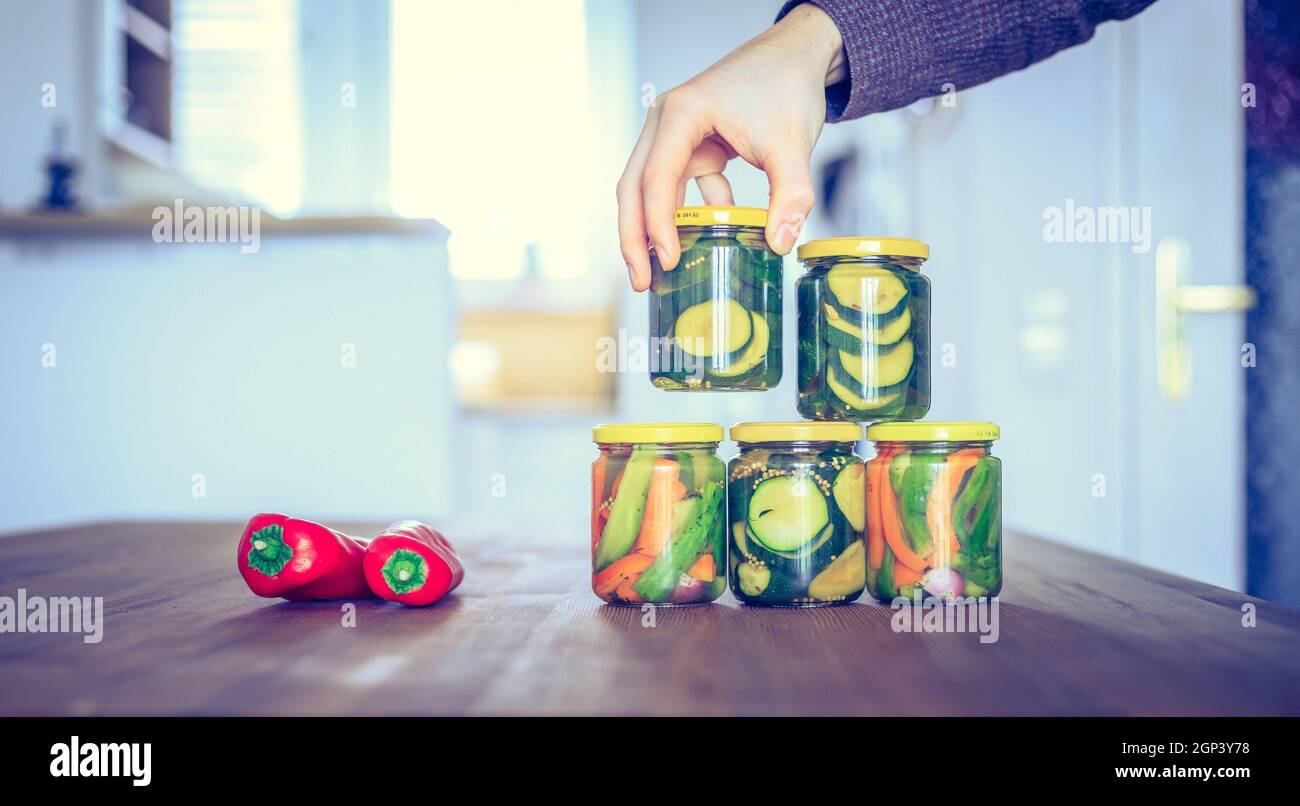 Preserving and conserving a variety of vegetables in glasses Stock ...