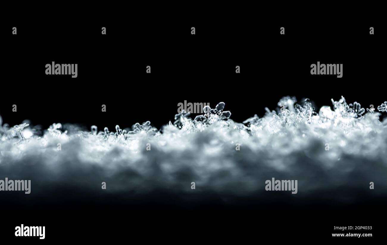 Natural snow texture with snowflakes close-up on the window, isolated ...