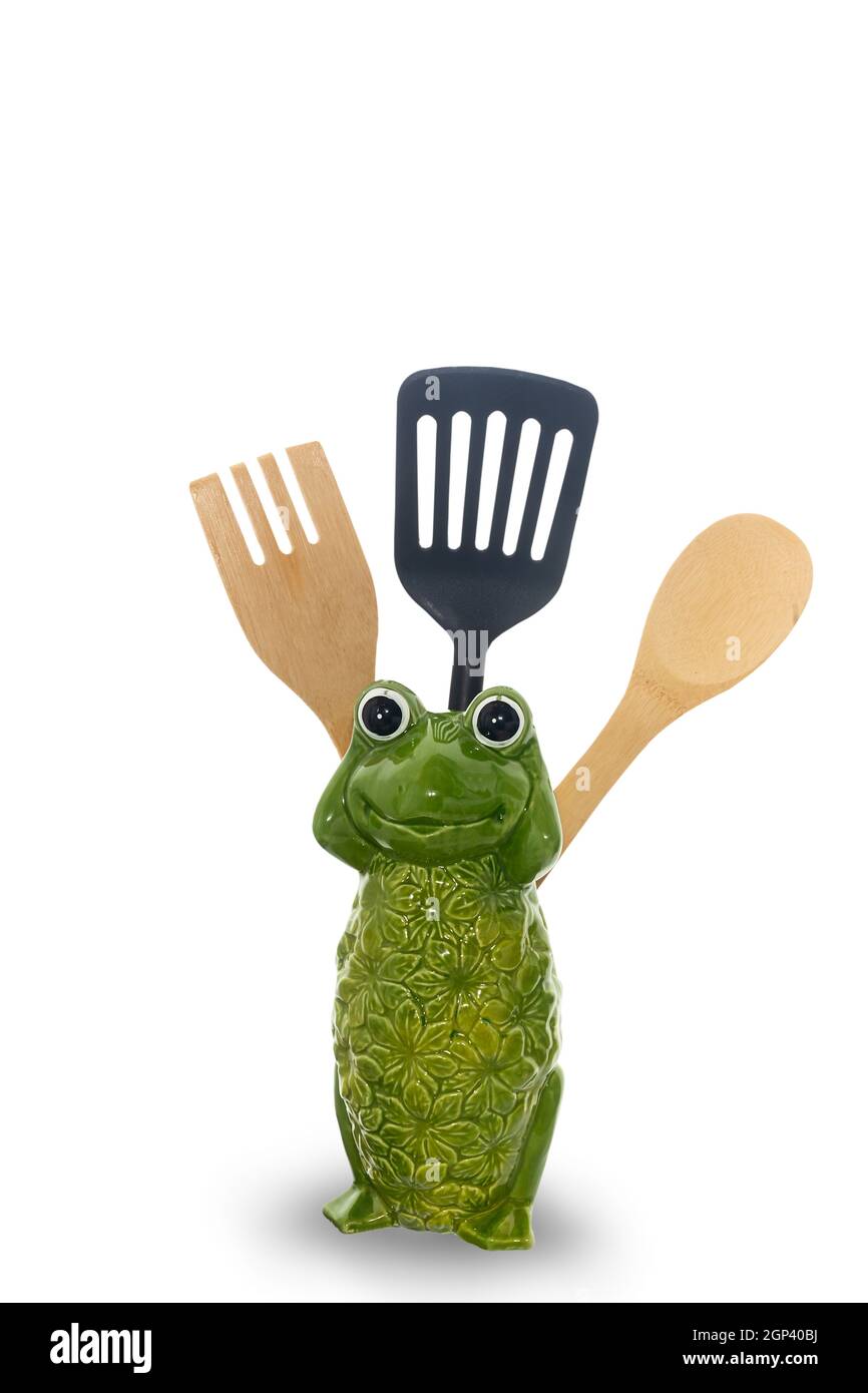 In a ceramic stand in the form of a frog, wooden and plastic kitchen ...