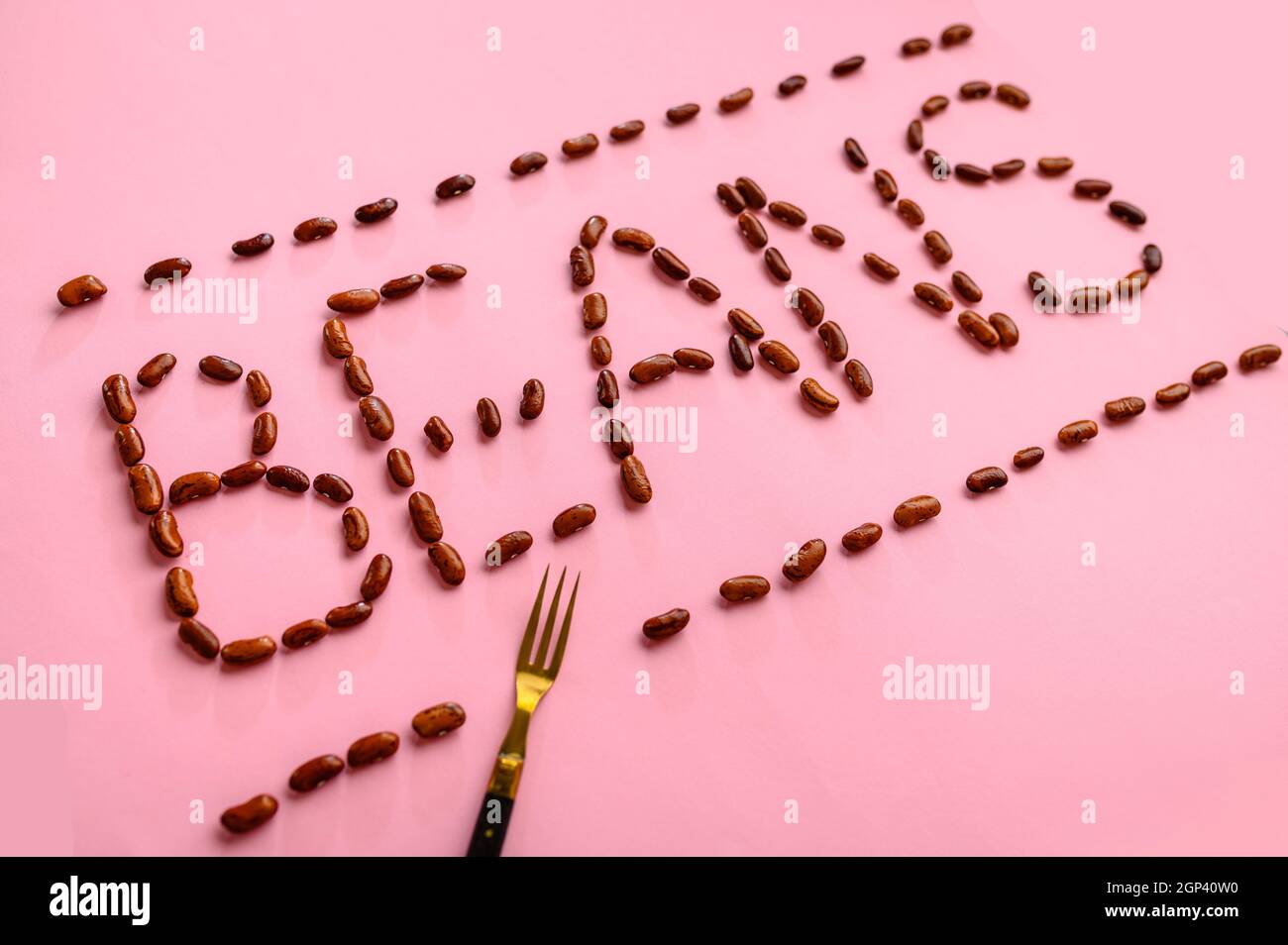 Beans word isolated on pink background, top view. Organic vegetarian ...