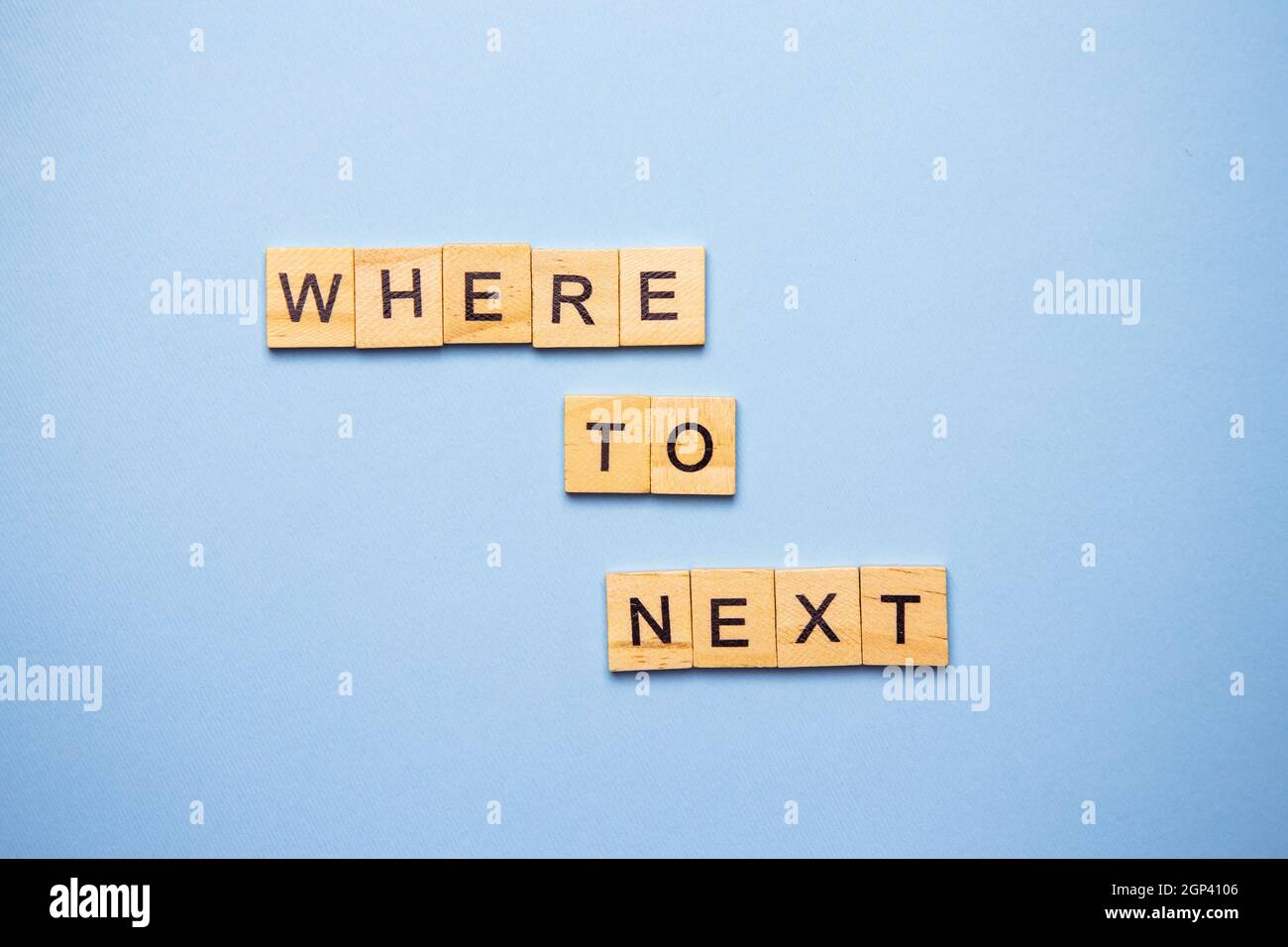 The inscription where to next wooden letters on a blue background, a top view Stock Photo - Alamy