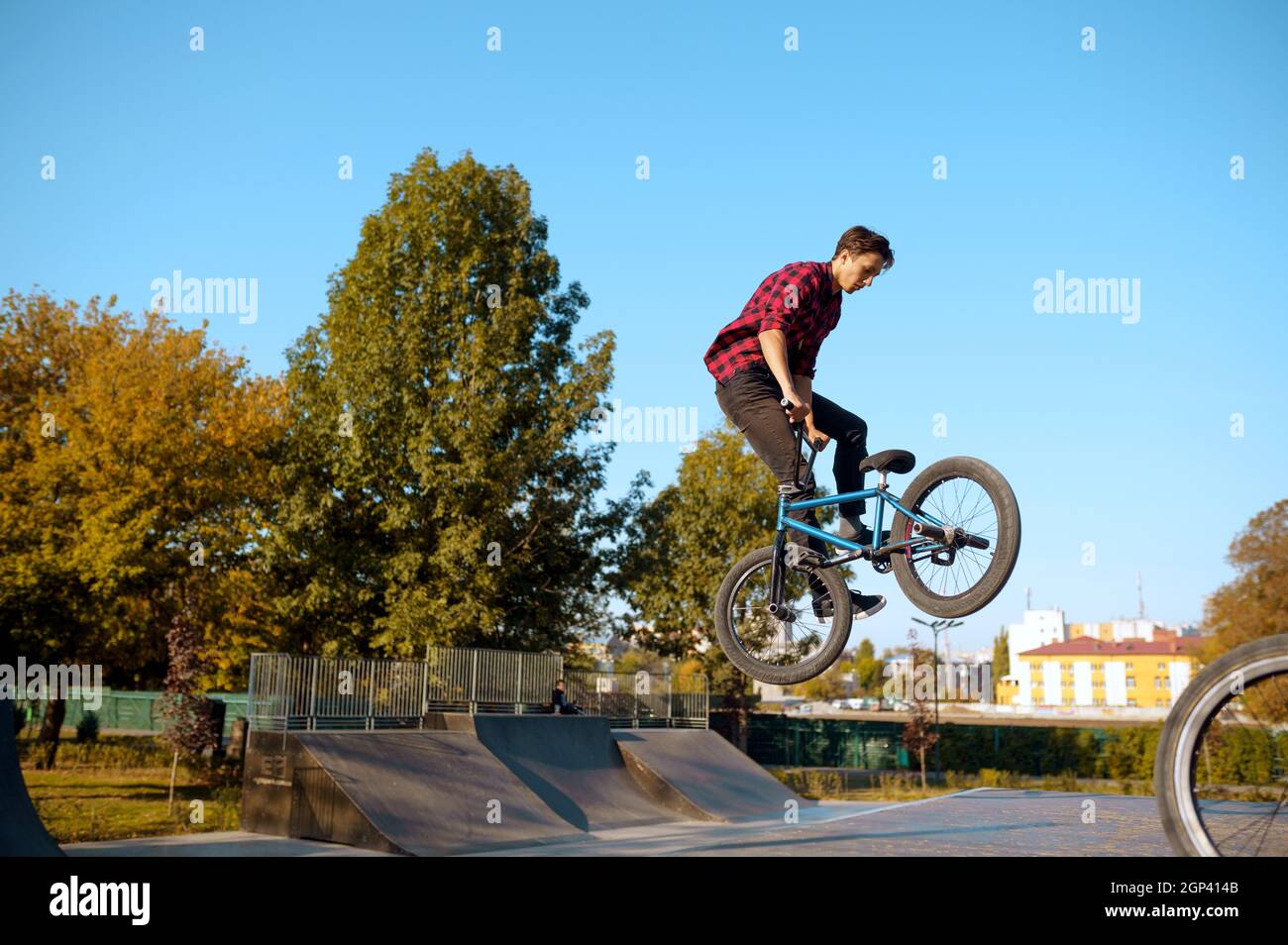 Bmx biker on ramp, jump in action, training in skatepark. Extreme ...
