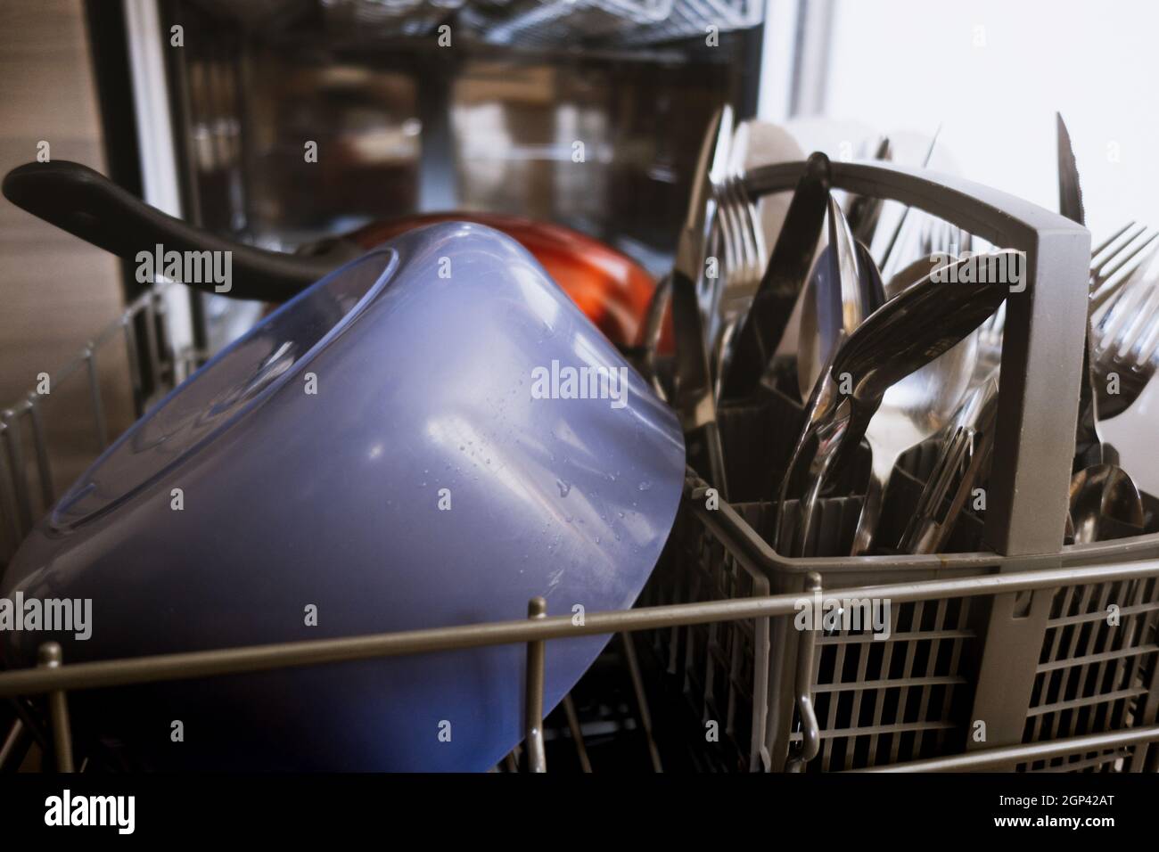 Open dishwasher in a kitchen. Closeup view Stock Photo - Alamy