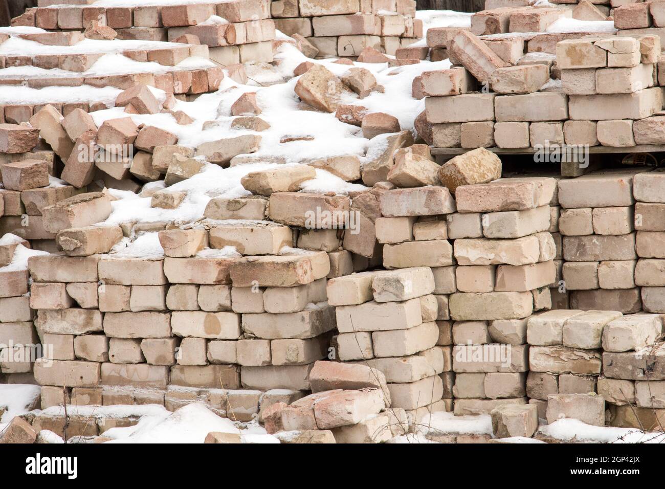 Pile of masonry bricks under the snow Stock Photo - Alamy