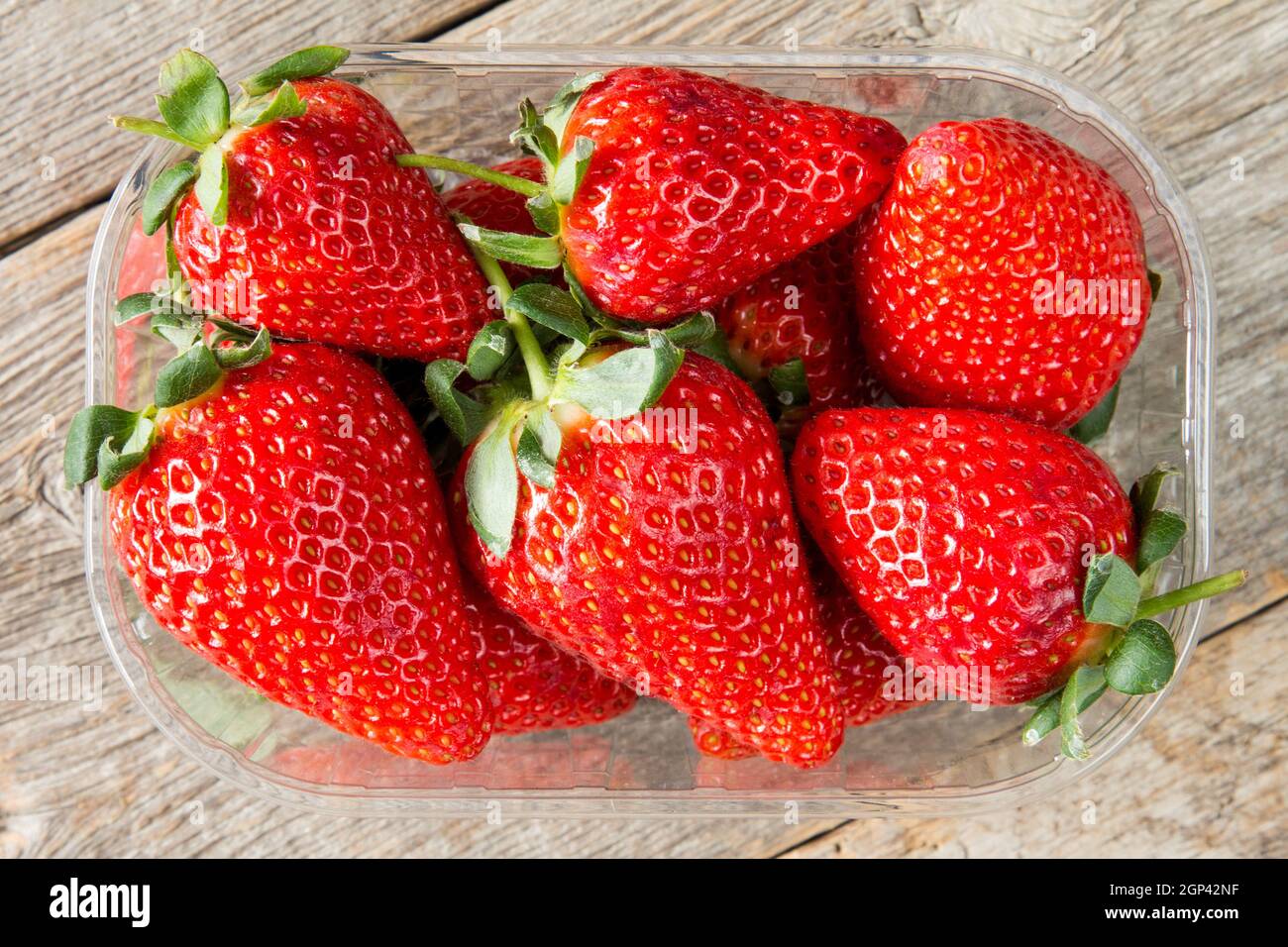 Plastic box full of red strawberries. Top view Stock Photo - Alamy