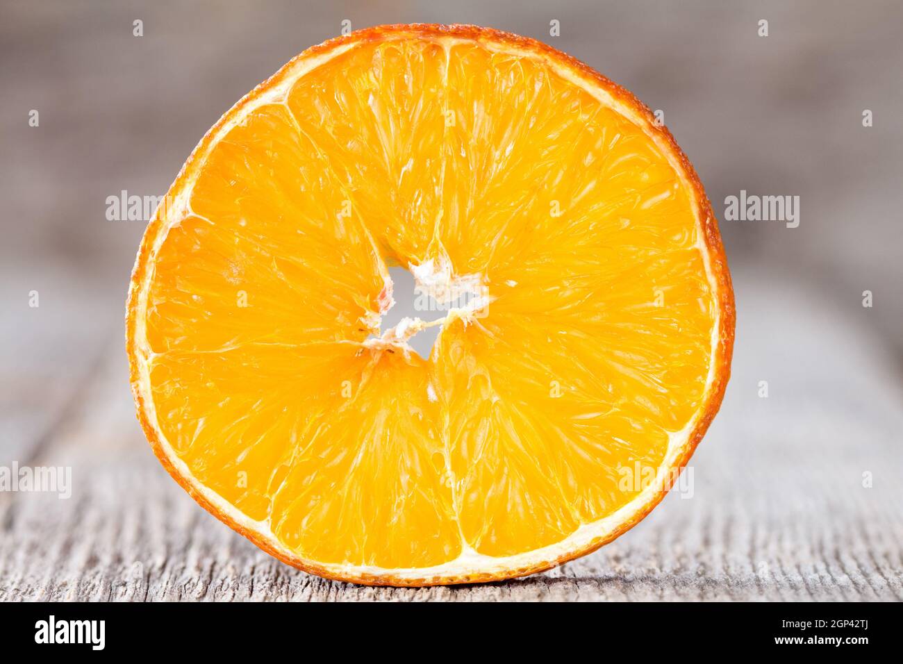 Cross section of orange fruit,close up on wooden background Stock Photo ...