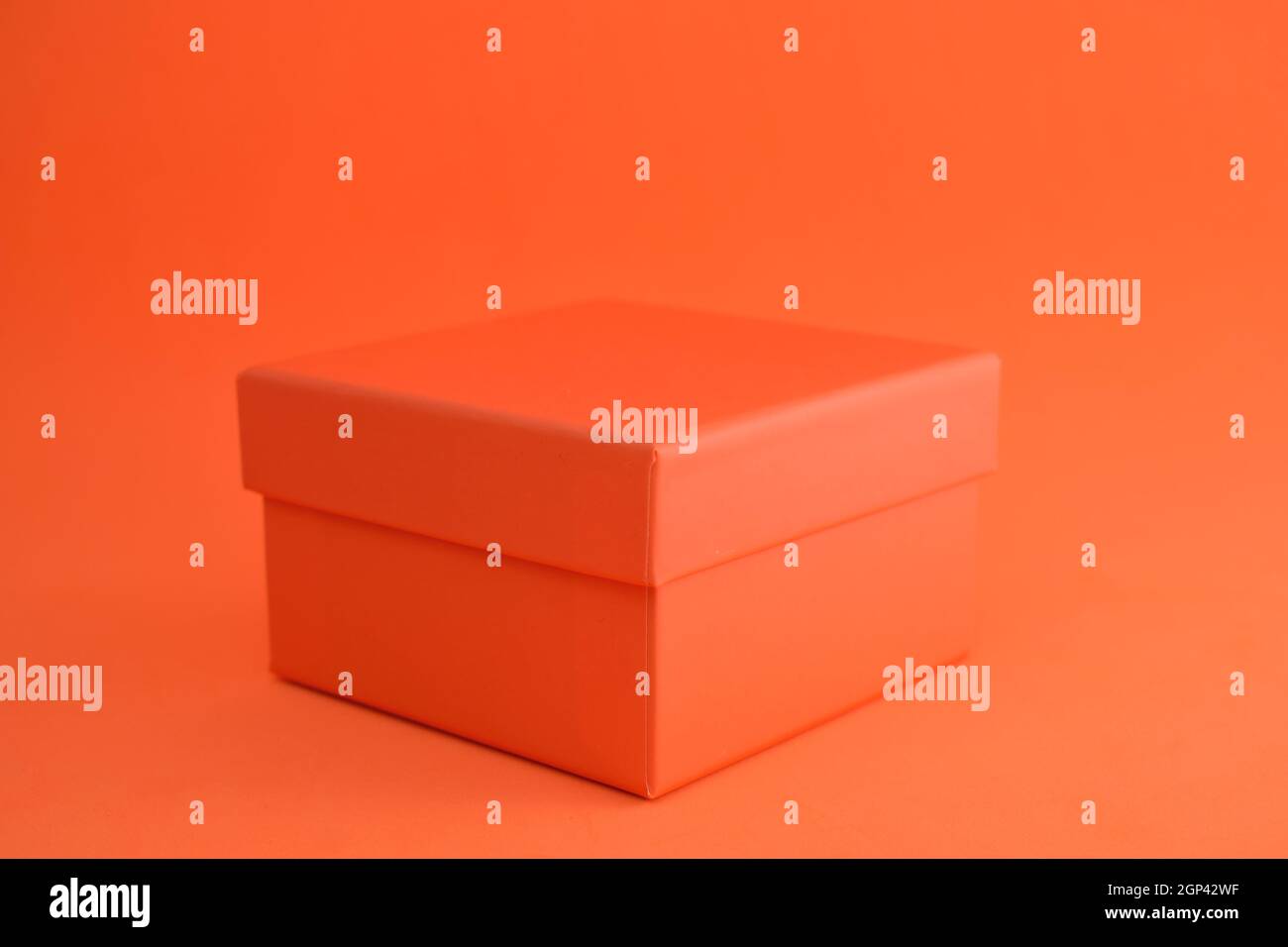 Orange gift box isolated on the same colored background Stock Photo - Alamy