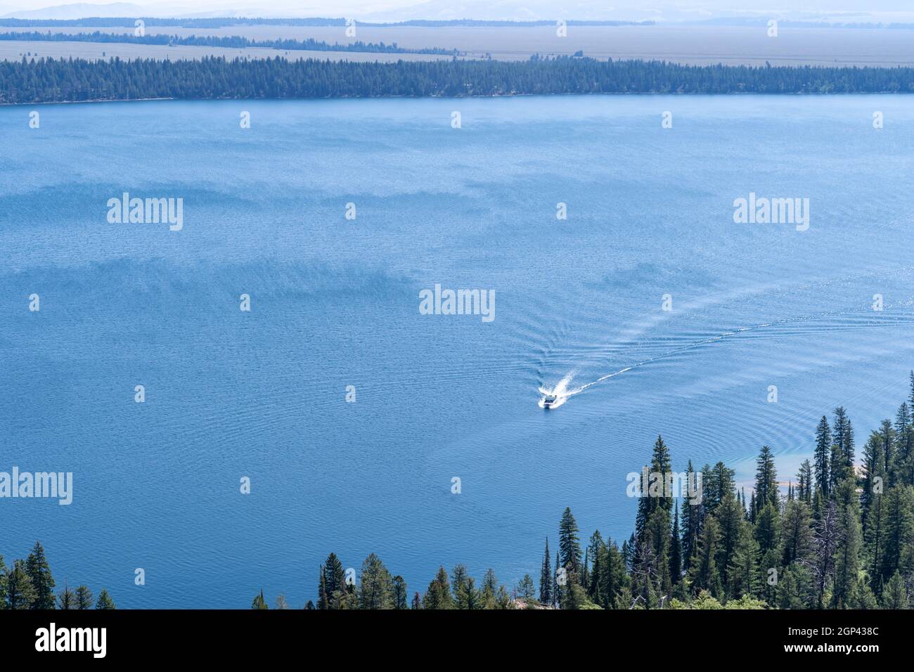 Shuttle boat makes its way across Jenny Lake in Grand Teton National ...